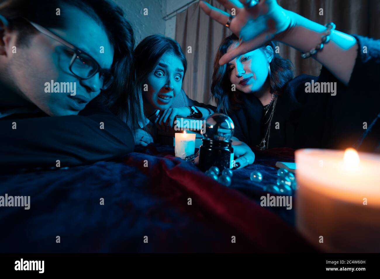 Group of people and woman fortune teller with crystal ball Stock Photo ...