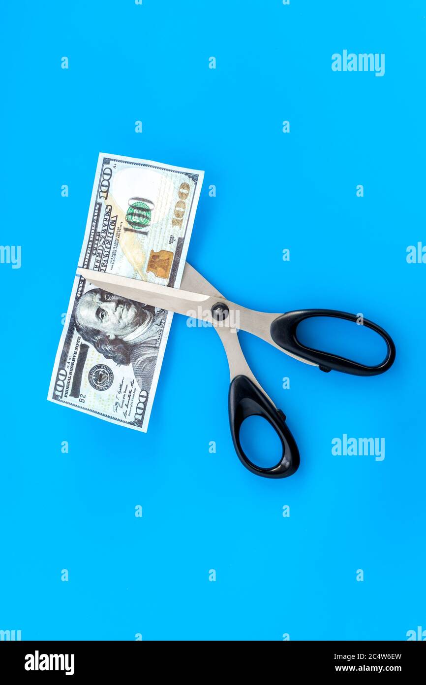 Scissors cutting dollar sign hi-res stock photography and images - Alamy
