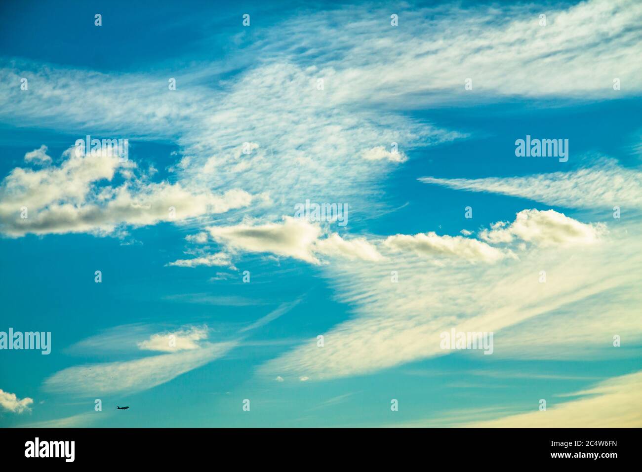 clouds with different shapes floating in the blue sky Stock Photo - Alamy
