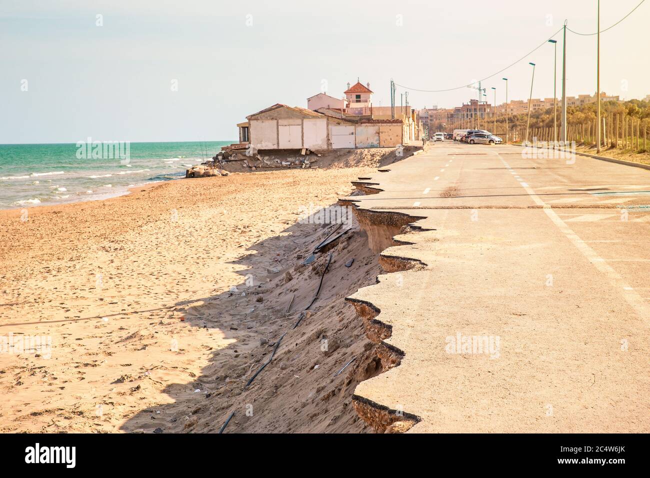 asphalt of the road cut by the waves in a sea storm Stock Photo - Alamy