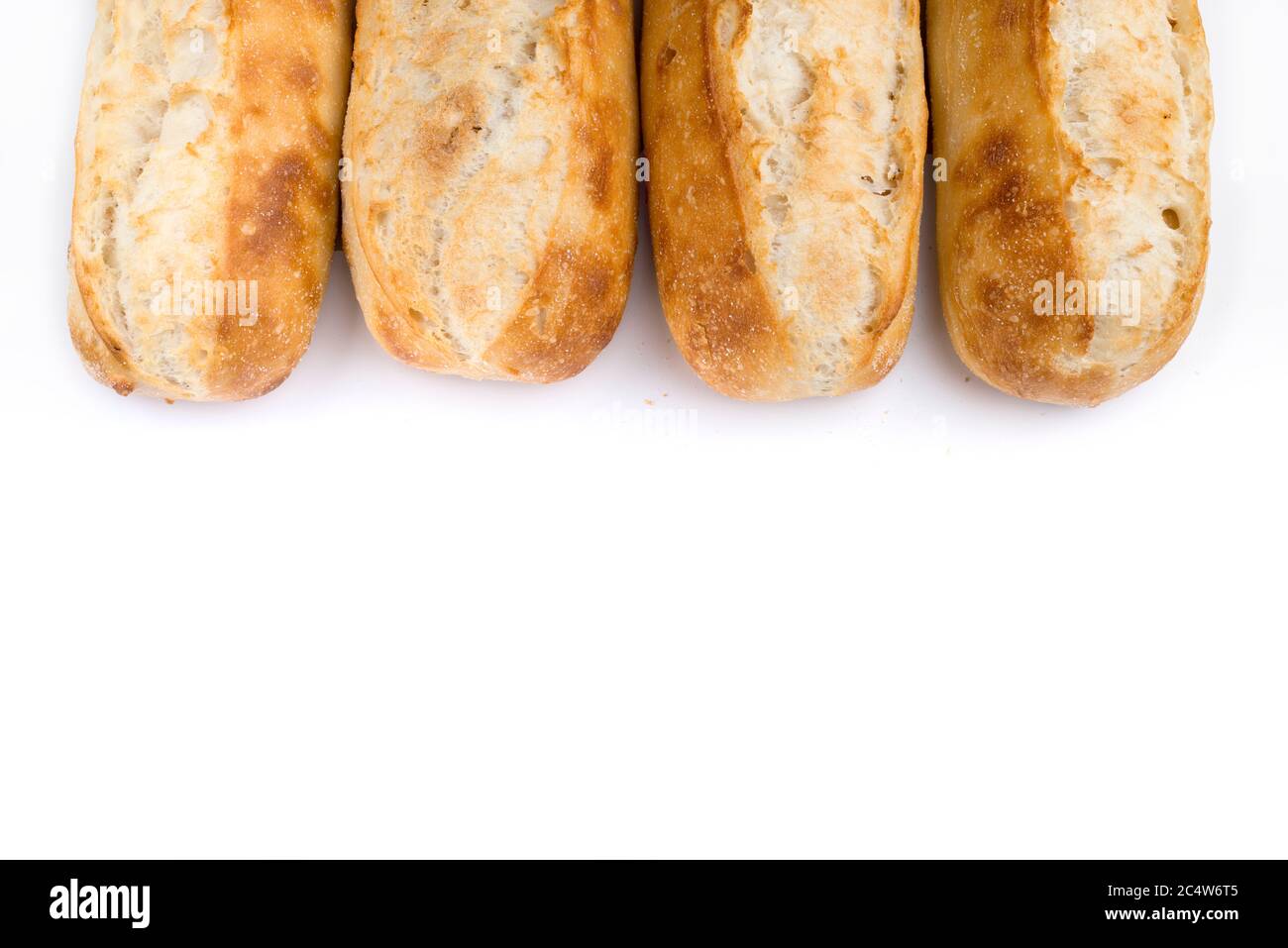 French bread rolls in a row with copy space Stock Photo - Alamy