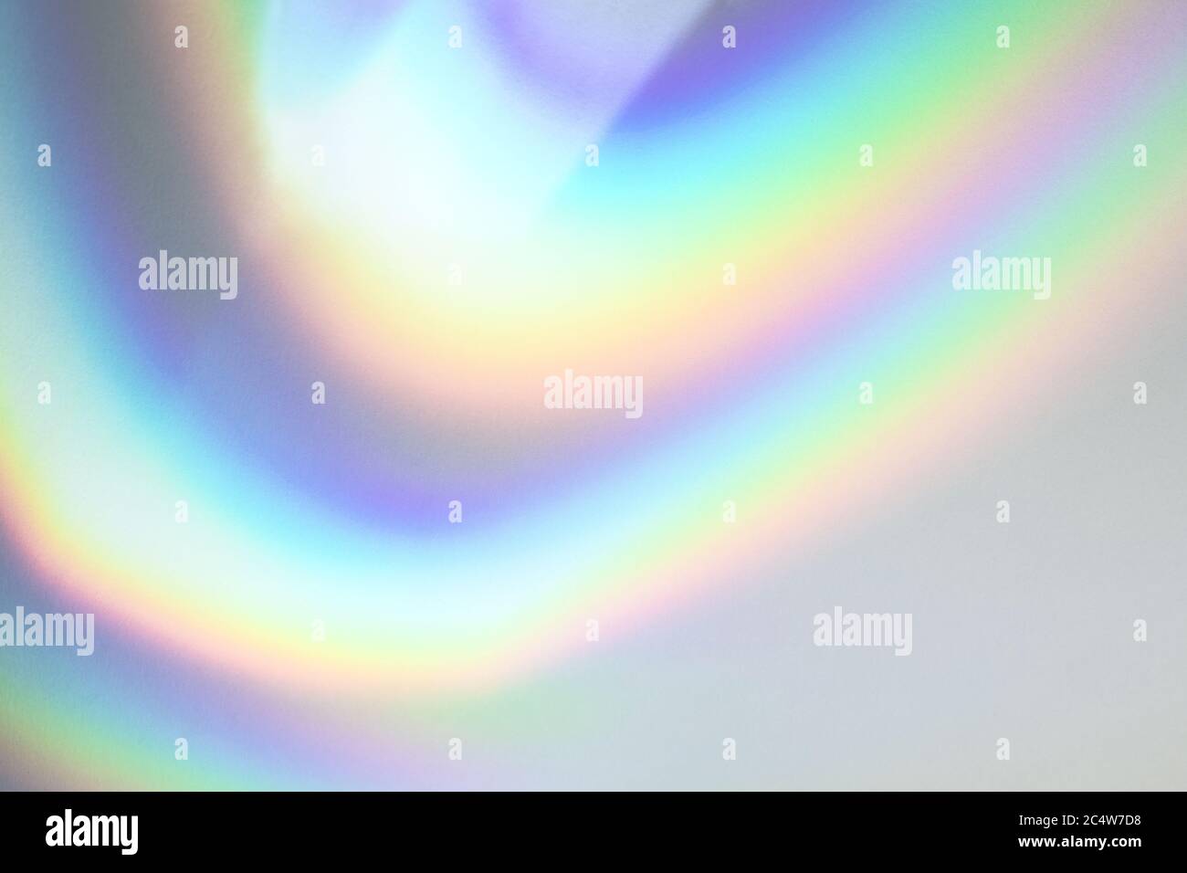 Blurred rainbow light refraction texture on white wall Stock Photo - Alamy