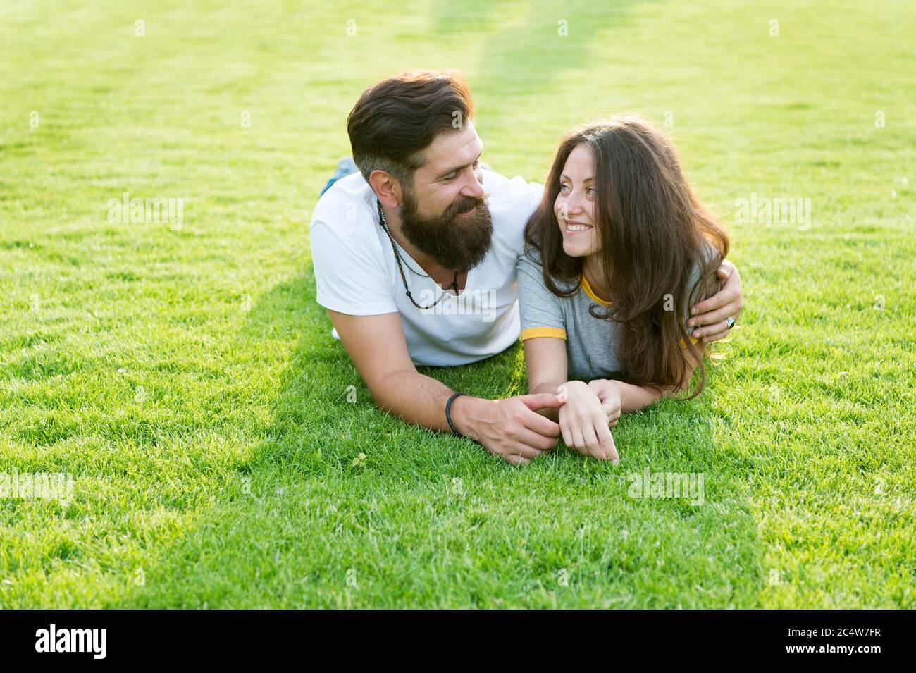 Happy summer. Happy family relax on green grass. Couple in love dating ...
