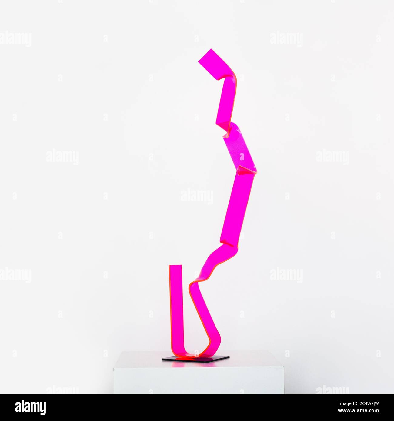 Pink ribbon flying in the air with a white background Stock Photo - Alamy