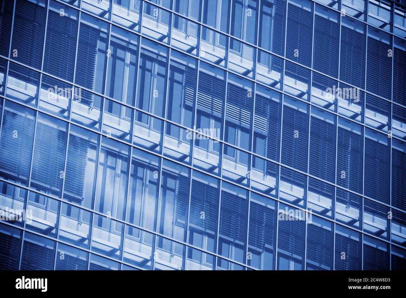 Close up shot of a skyscraper with blue glass walls Stock Photo - Alamy