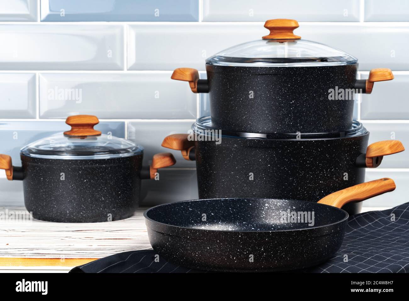 Close up photo of cookware set on kitchen counter Stock Photo - Alamy