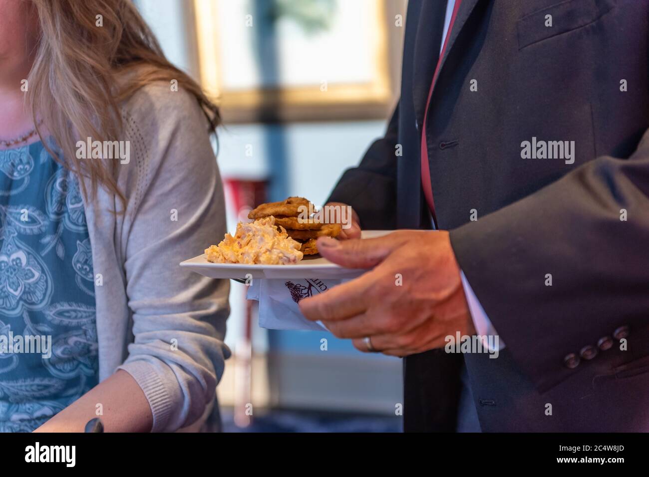 Close up shot of person carrying a food plate Stock Photo - Alamy