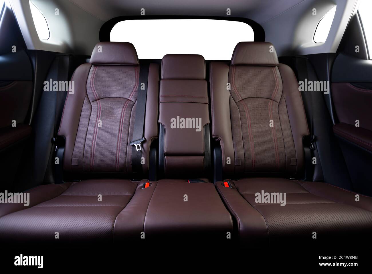 Back passenger seats in modern luxury car, frontal view, red leather ...