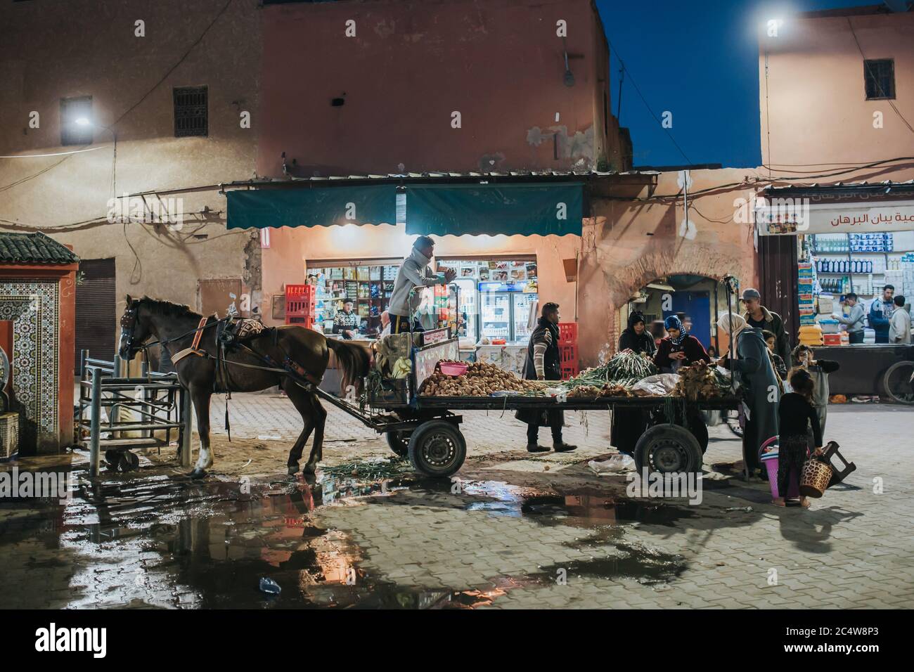 Marrakech, Morocco - March 11, 2019: People trading vegetables from a ...