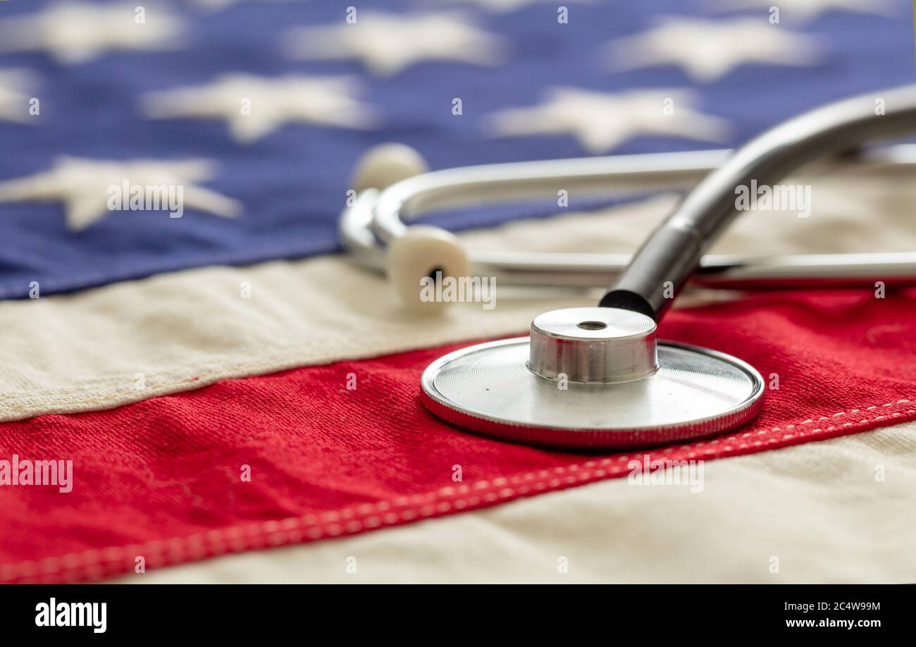 USA health care. Medical stethoscope on a US of America flag, closeup ...