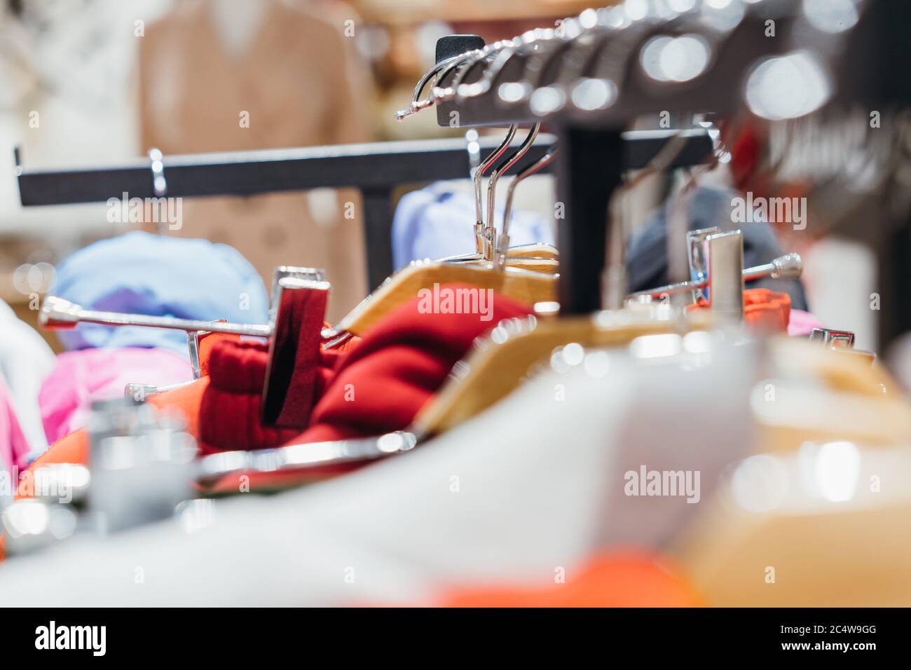 fashion clothing on hangers at the show Stock Photo - Alamy