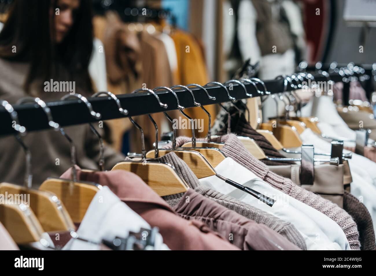 fashion clothing on hangers at the show Stock Photo - Alamy