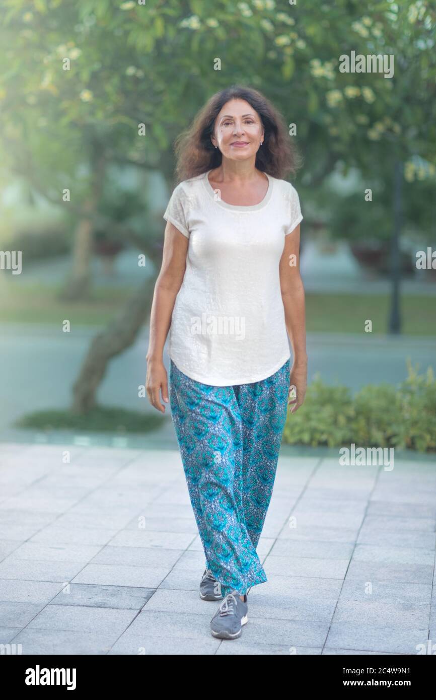 Outdoor portrait of a beautiful smiling senior woman Stock Photo - Alamy