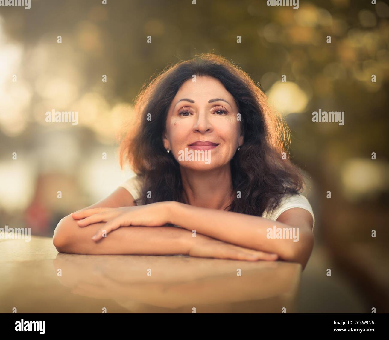 Outdoor portrait of a beautiful smiling senior woman Stock Photo - Alamy