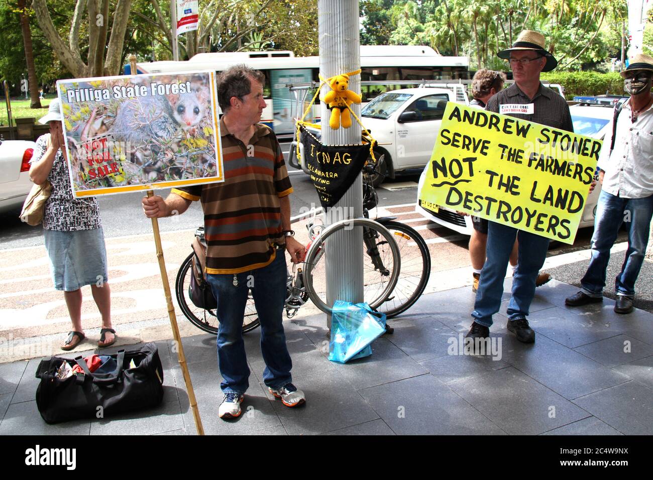 Protesters hold signs saying, ‘Pilliga State Forest not for sale’ and ...