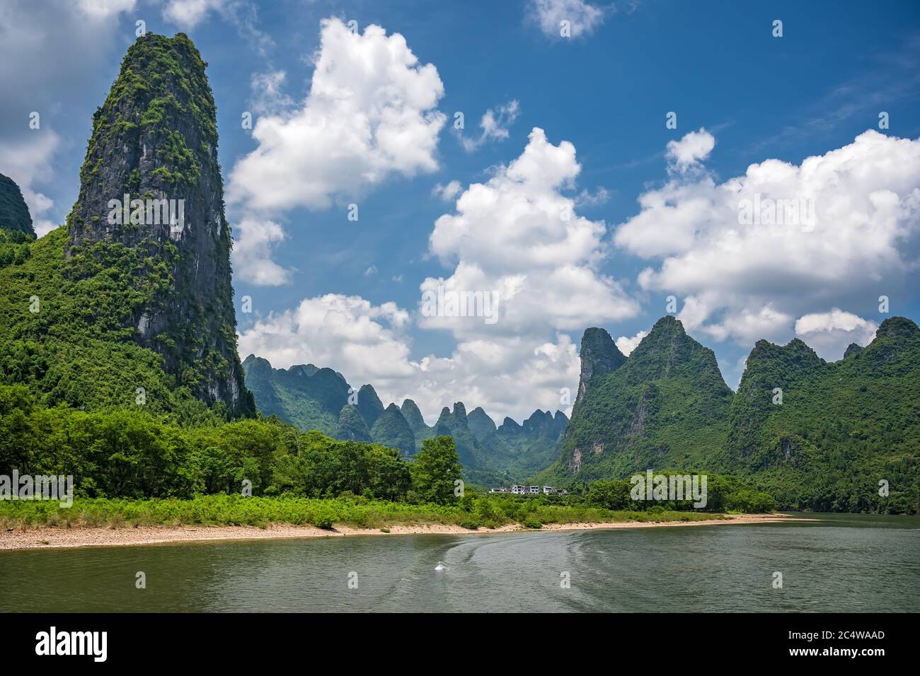 Panoramic view of the stunning karst mountain scenery on the riverbank ...