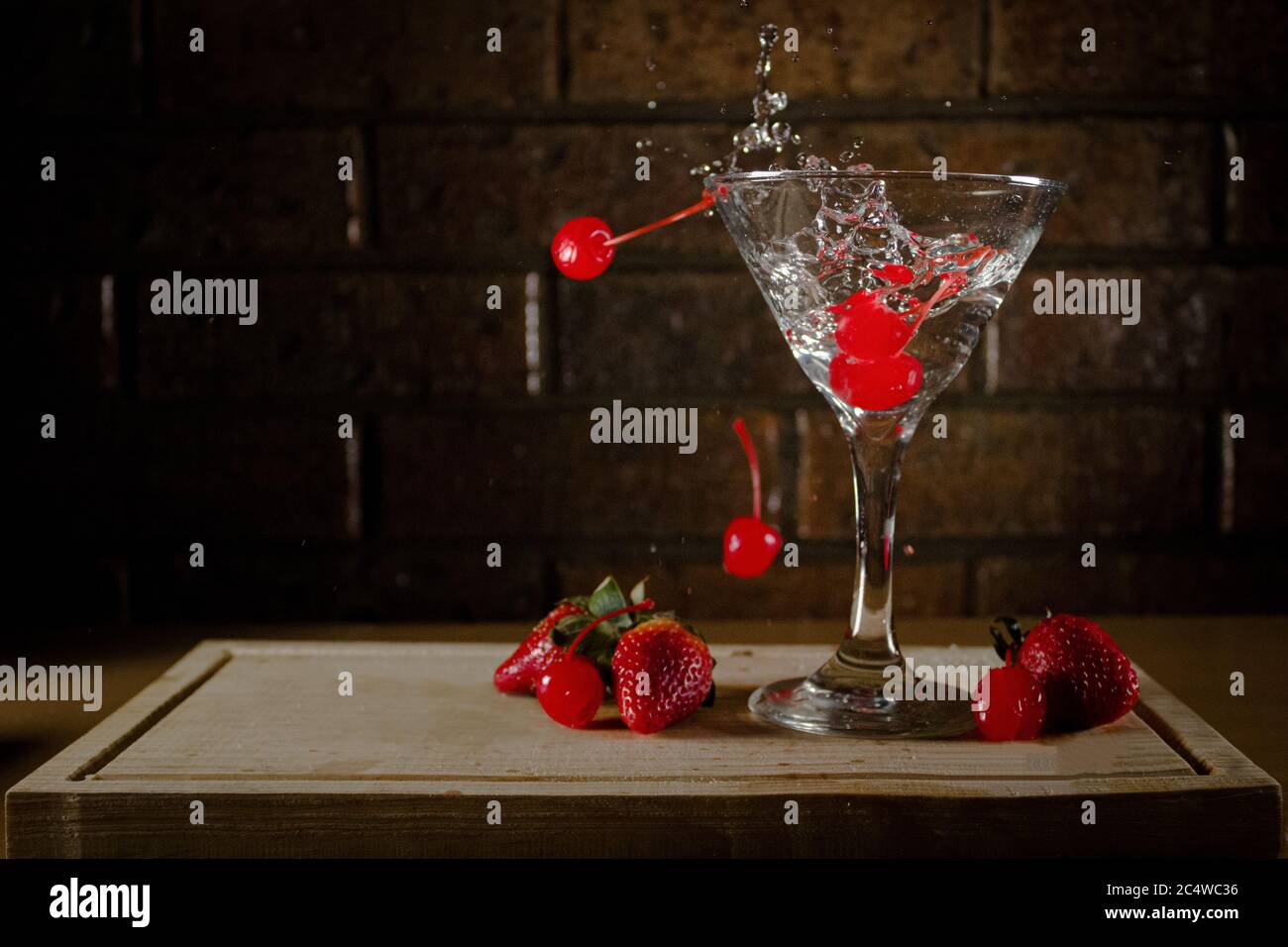 Red cherry falling cocktail glass hi-res stock photography and images ...