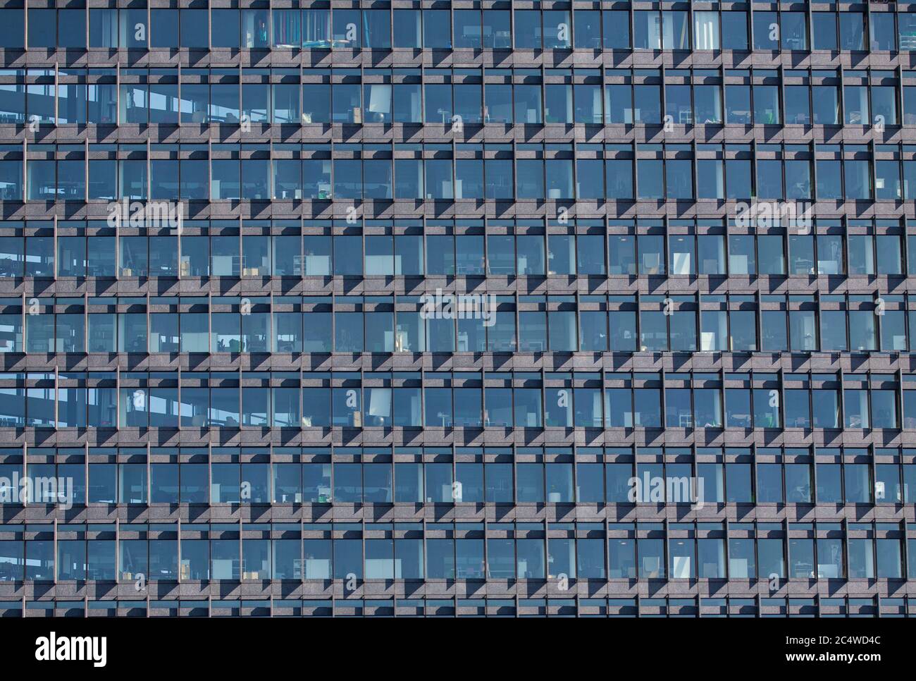 Lots of uniform windows of a modern high rise office building ...