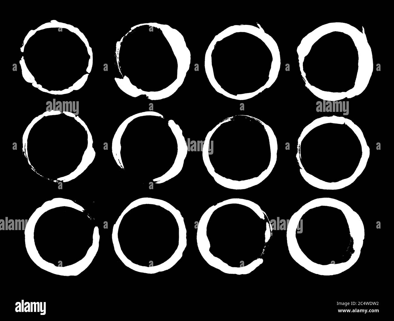 circular brushstroke or circle print. white paint on a black background ...