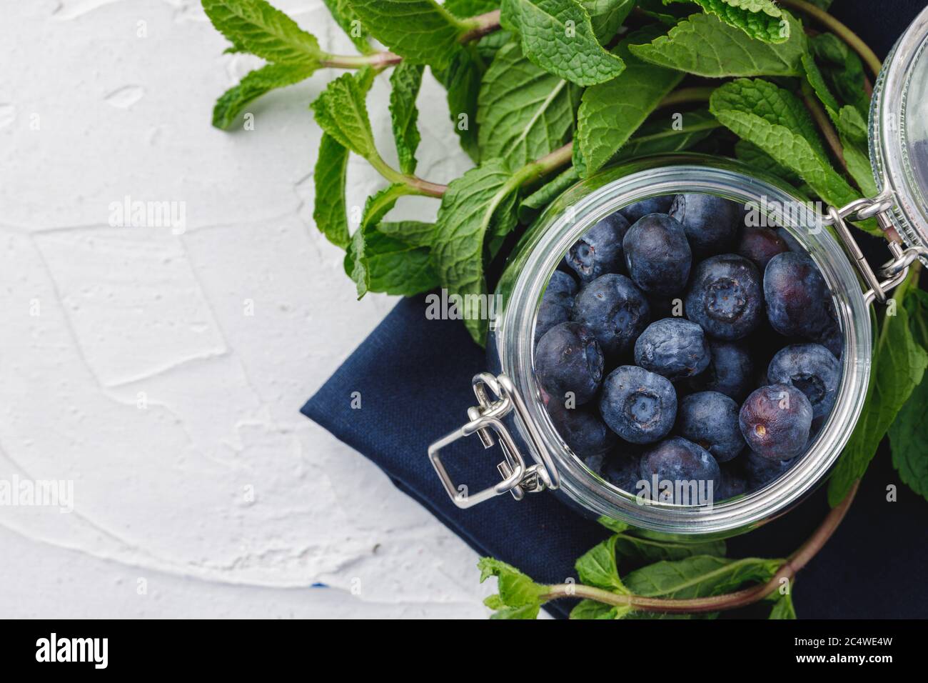 Blueberries in a glass bowl close up Stock Photo - Alamy