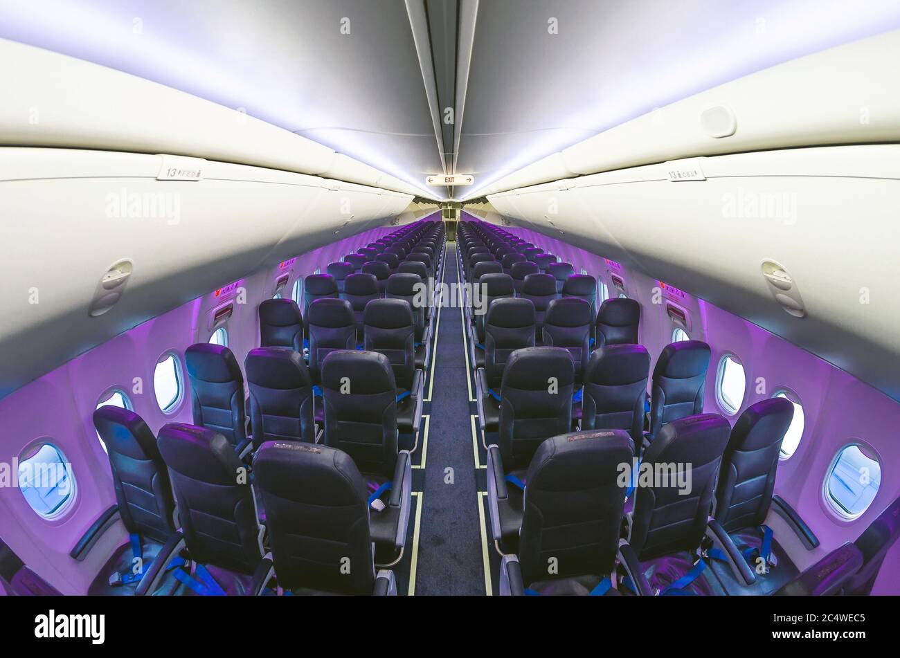 Inside airplane light view in passenger seats Stock Photo - Alamy