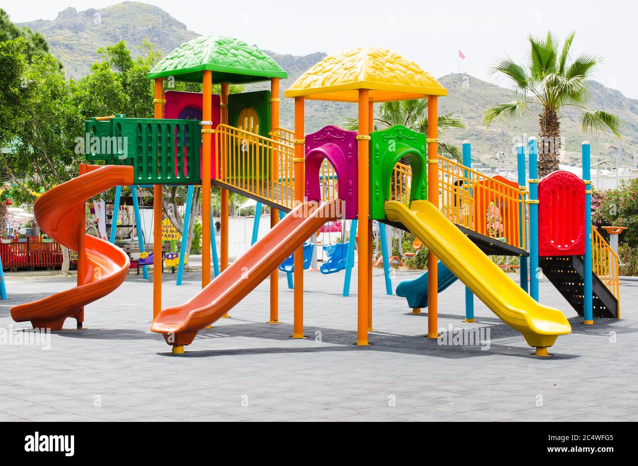 Empty children playground activities in public park surrounded by green ...