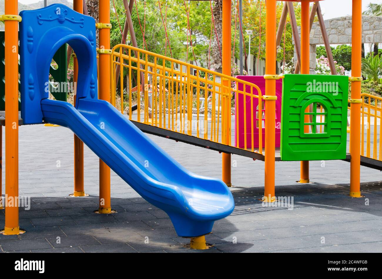 Empty children playground activities in public park surrounded by green ...