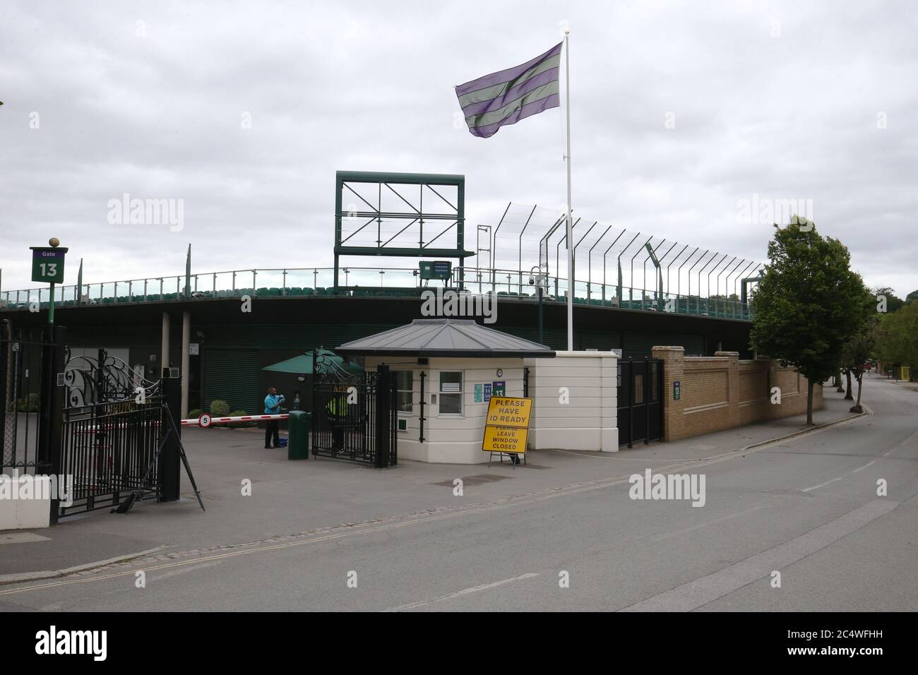 Security signage on display outside gate twelve at the All England Lawn ...