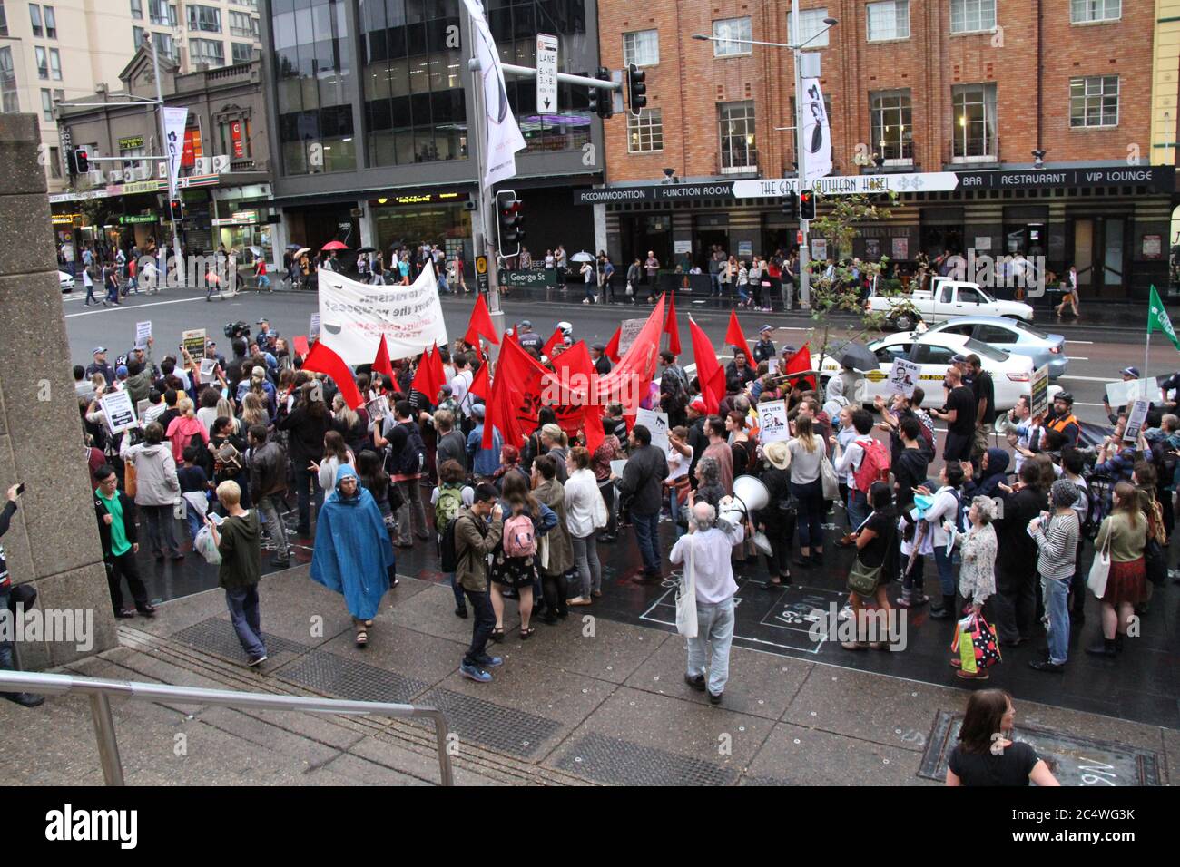 Protesters march along the pavement on George Street towards the ...
