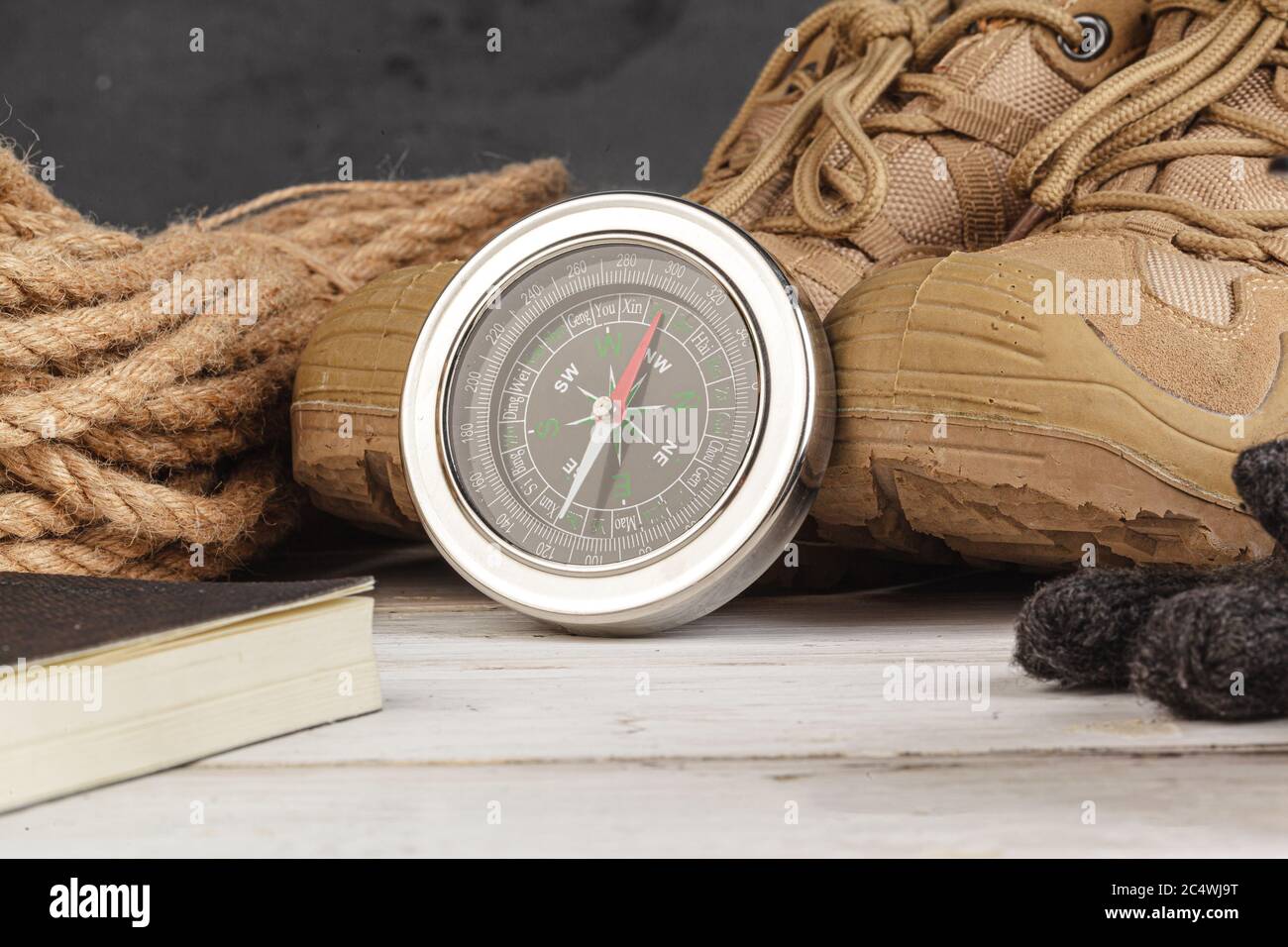Compass surrounded by mountain gear tools on wooden background Stock ...