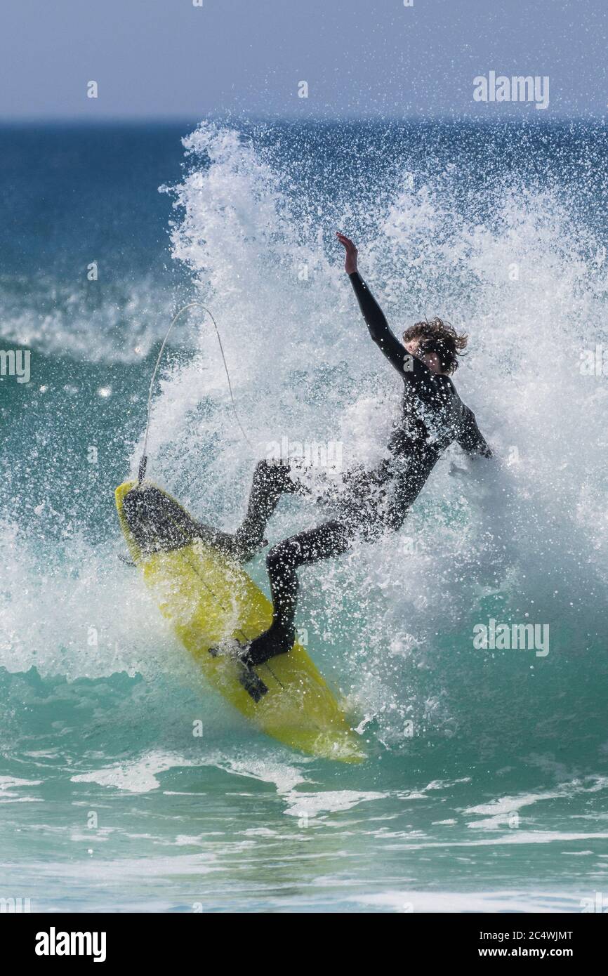 Spectacular action as a surfer rides a wave at Fistral in Newquay in ...