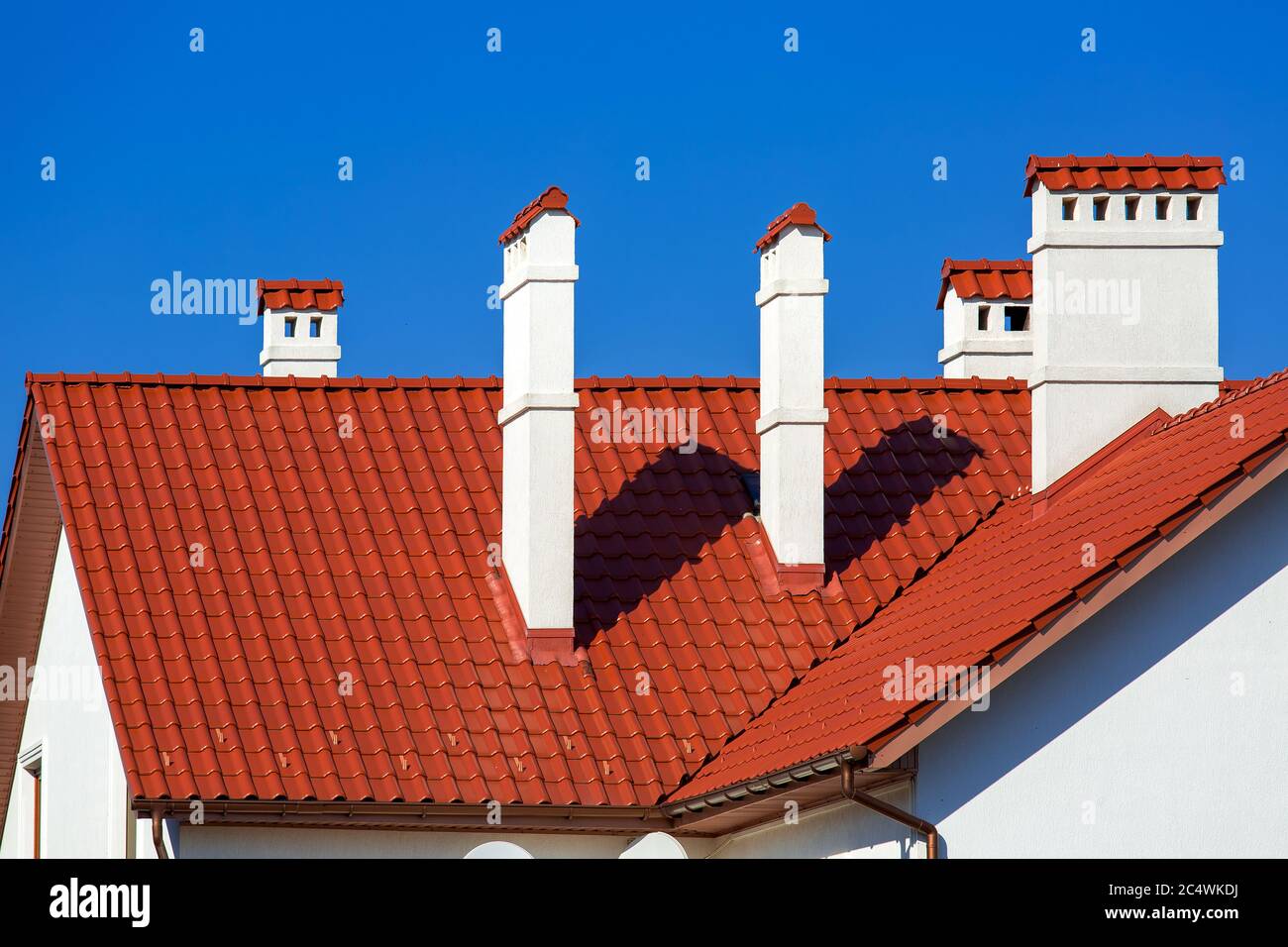 an orange rooftop of a ceramic tile with ventilation by a pipe a storm ...