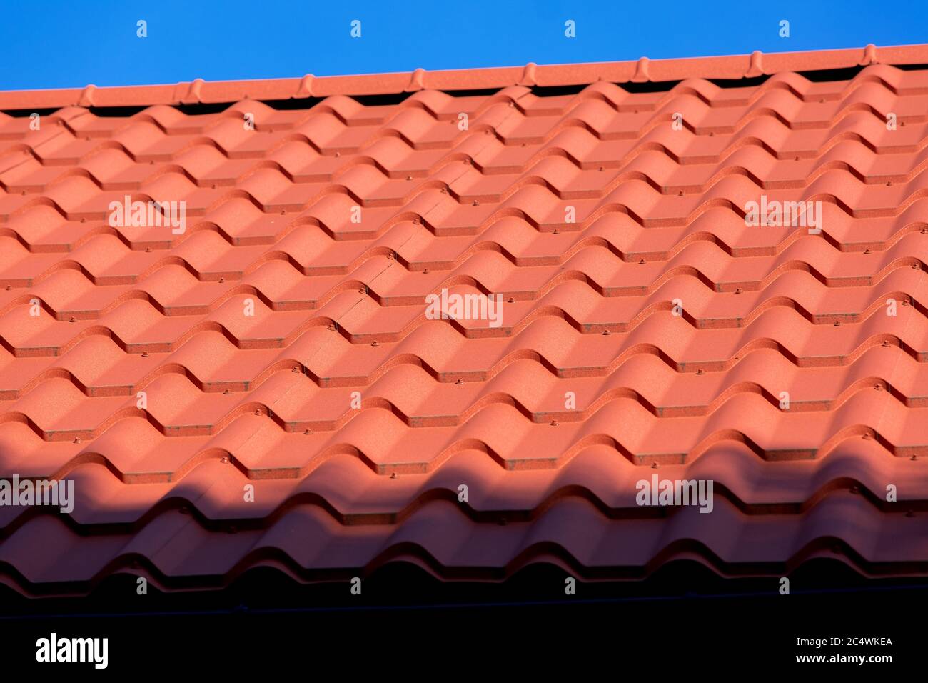 new clean orange roof tiles, close up Stock Photo - Alamy