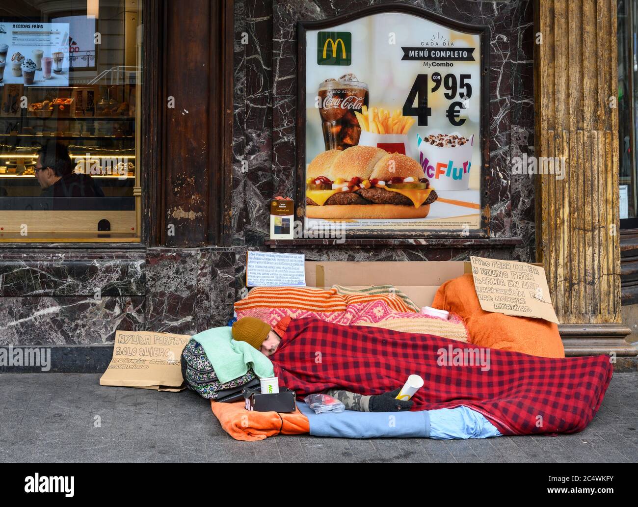 Homeless man sleeping on sidewalk hi-res stock photography and images ...
