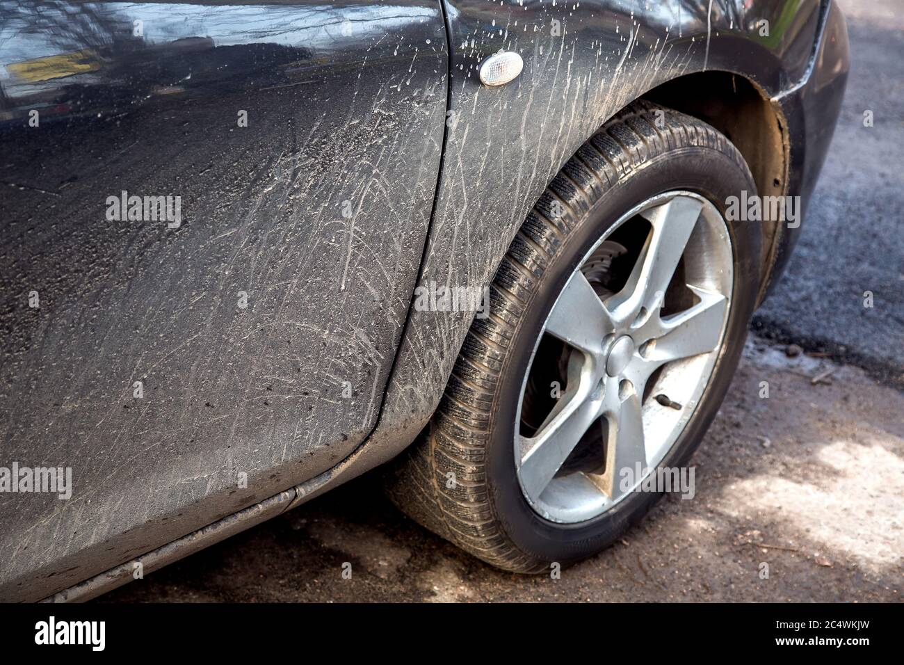 Dirty car wing, side view from the top to the front of the car with ...