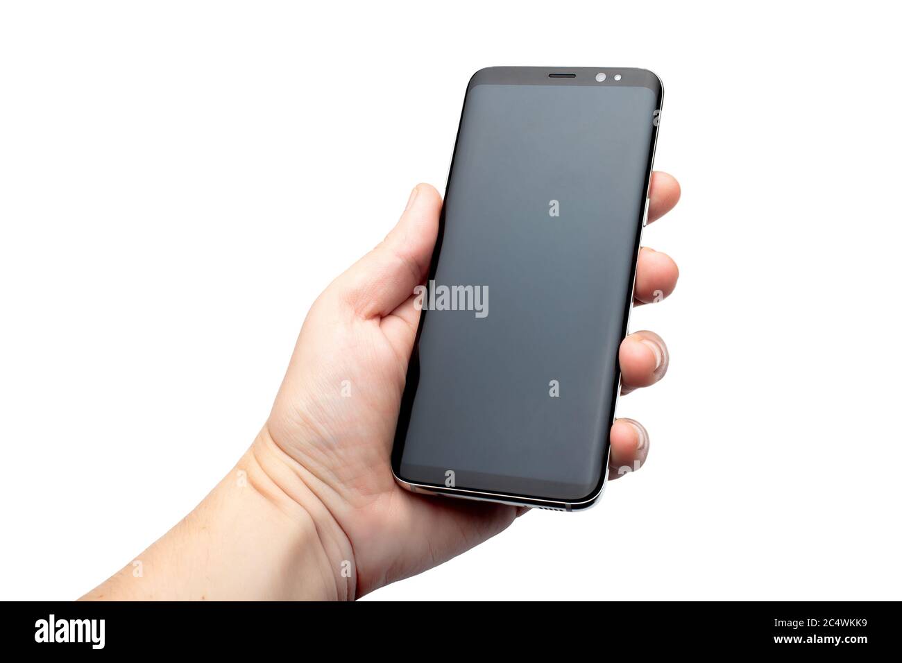 Smartphone in hand, man's hand holds a glass mobile phone with rounded ...