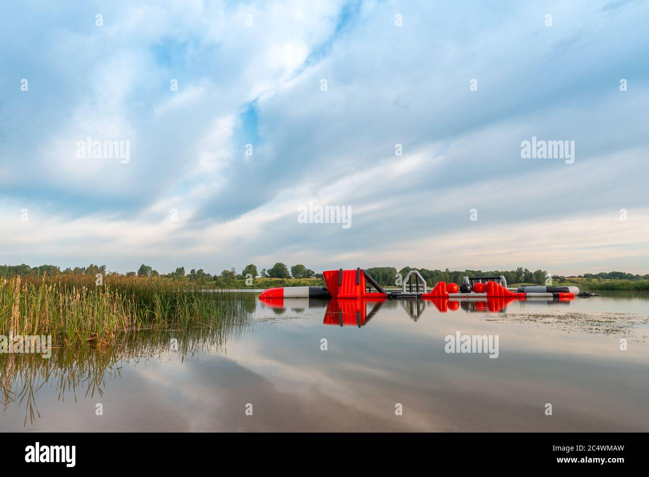 Inflatable floating slider water park. Water outdoor bouncy park ...