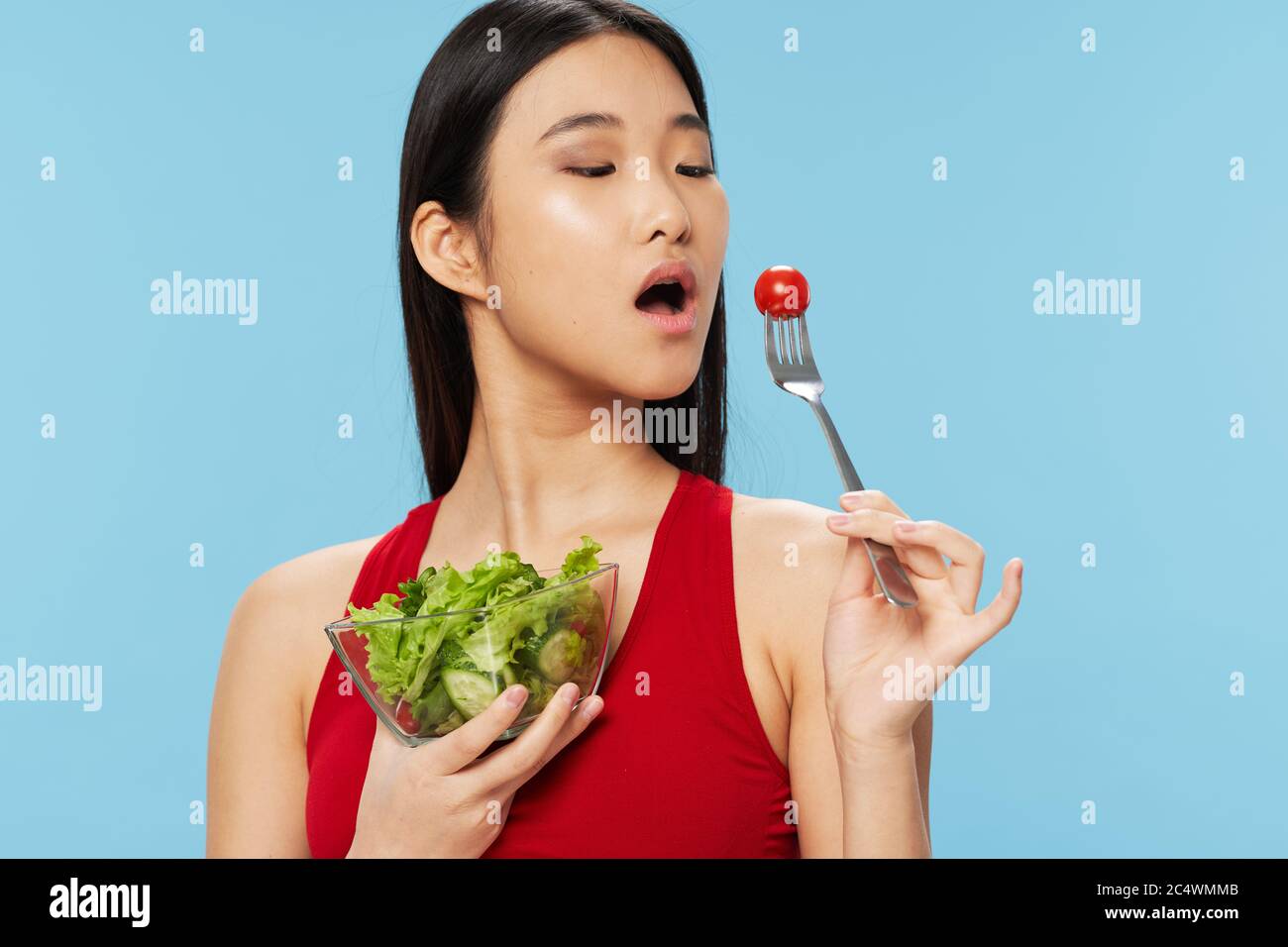 Beautiful woman of Asian appearance salad Stock Photo - Alamy