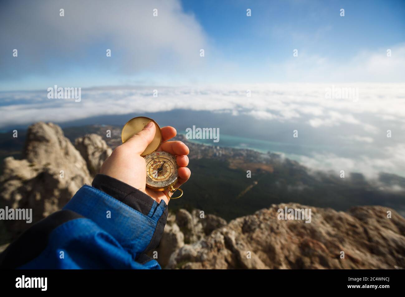 Point of view photo of explorer man searching direction with golden ...