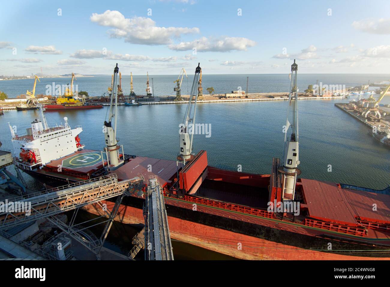 Big grain terminal at seaport. Cereals bulk transshipment from road ...