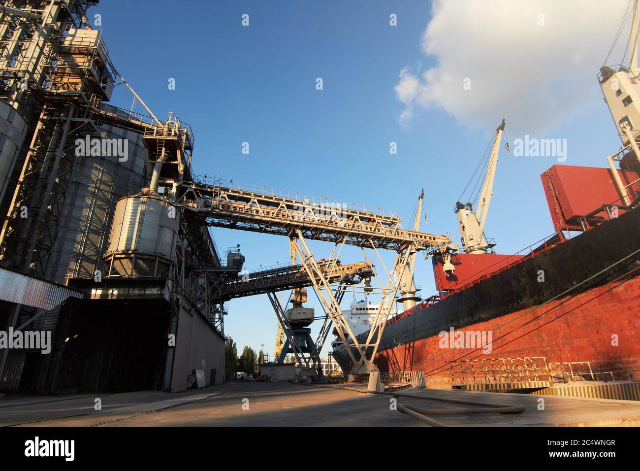 Big grain terminal at seaport. Cereals bulk transshipment from road ...