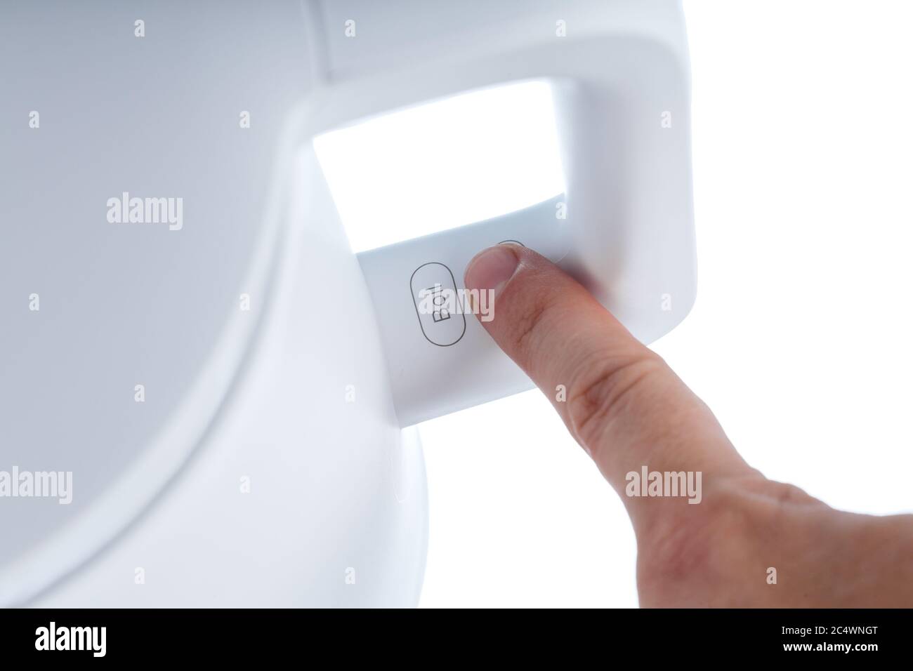 A close-up of the process of pressing the touch button of a person's ...