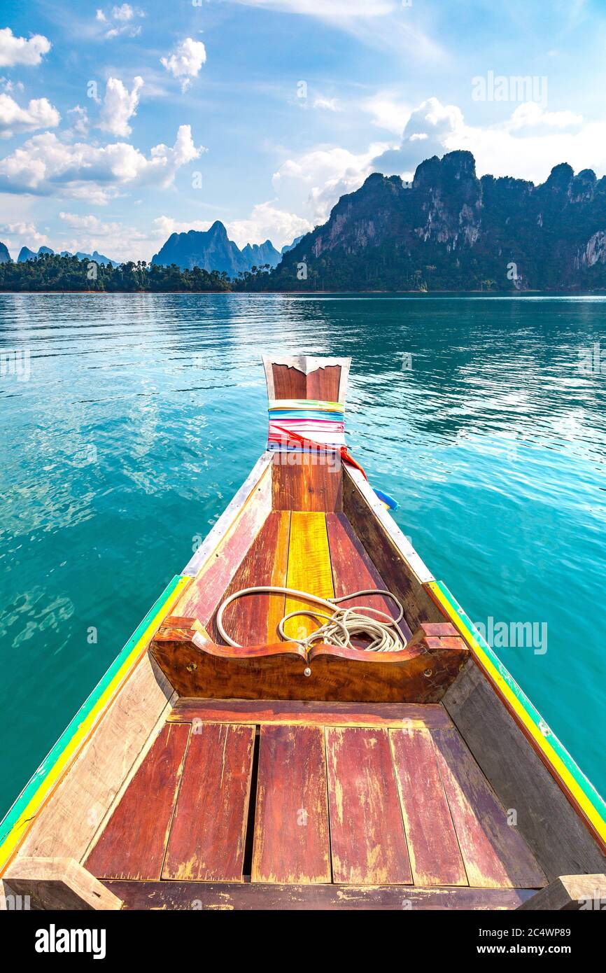 Wooden thai traditional long tail boat on Cheow Lan lake, Ratchaprapha ...