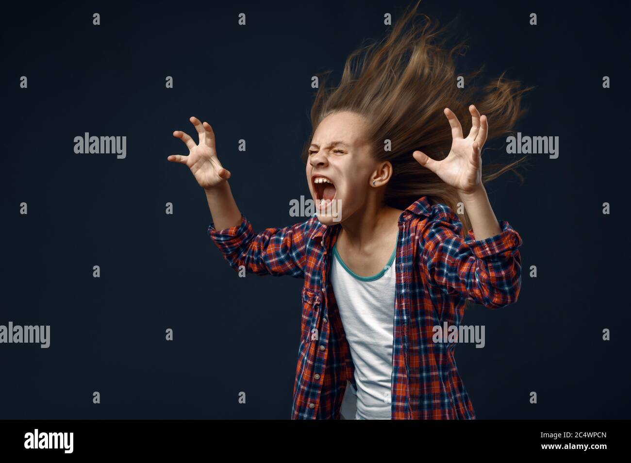 Little kid screams in studio, developing hairstyle Stock Photo - Alamy
