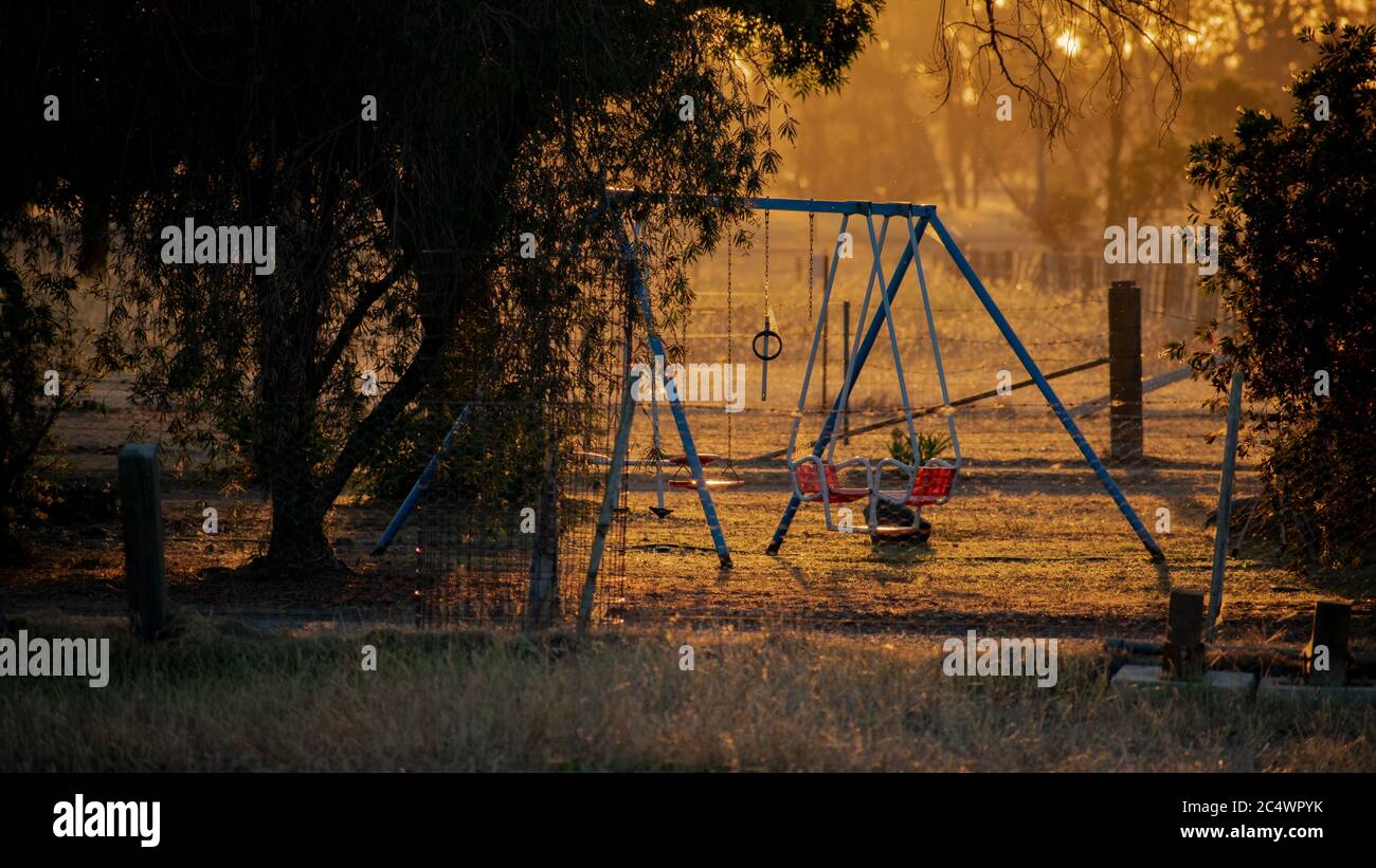 A swing during golden hours Stock Photo - Alamy