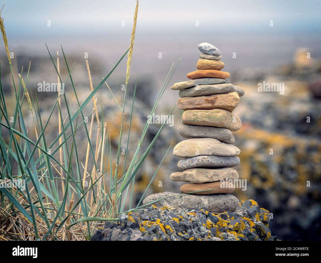 A balanced, stacked pile of stones and pebbles on a beach in East ...