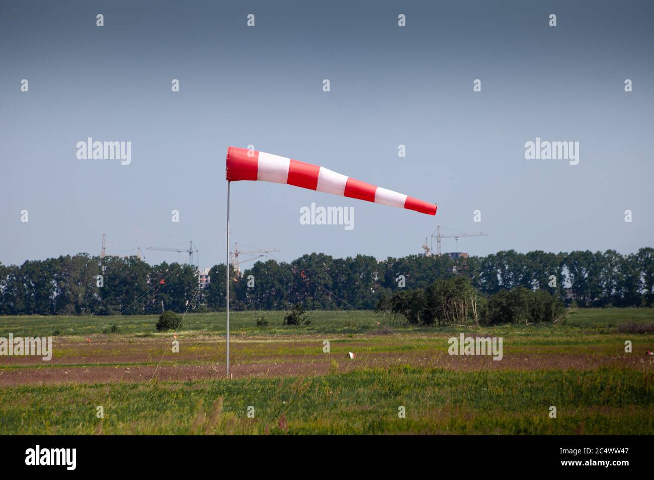 Windsock, weather vane for airfields. Red and white striped fabric ...