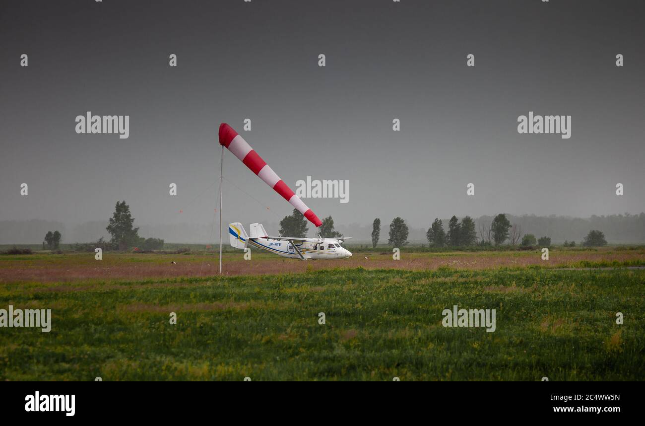 Windsock, weather vane for airfields. Red and white striped fabric ...