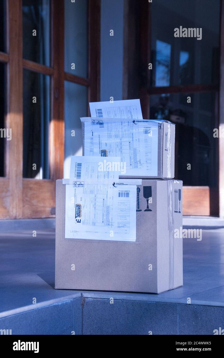Courier packages delivered door to door - concept Stock Photo - Alamy