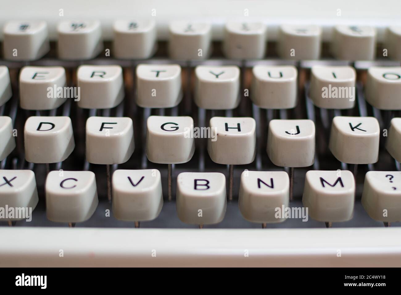background with old white typewriter keys Stock Photo - Alamy